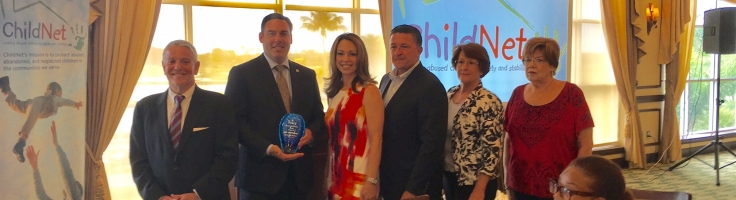 Ian_Cotner_with_award_at_podium_with_Larry_Rein_Liz_Quirantes_Avossa ...